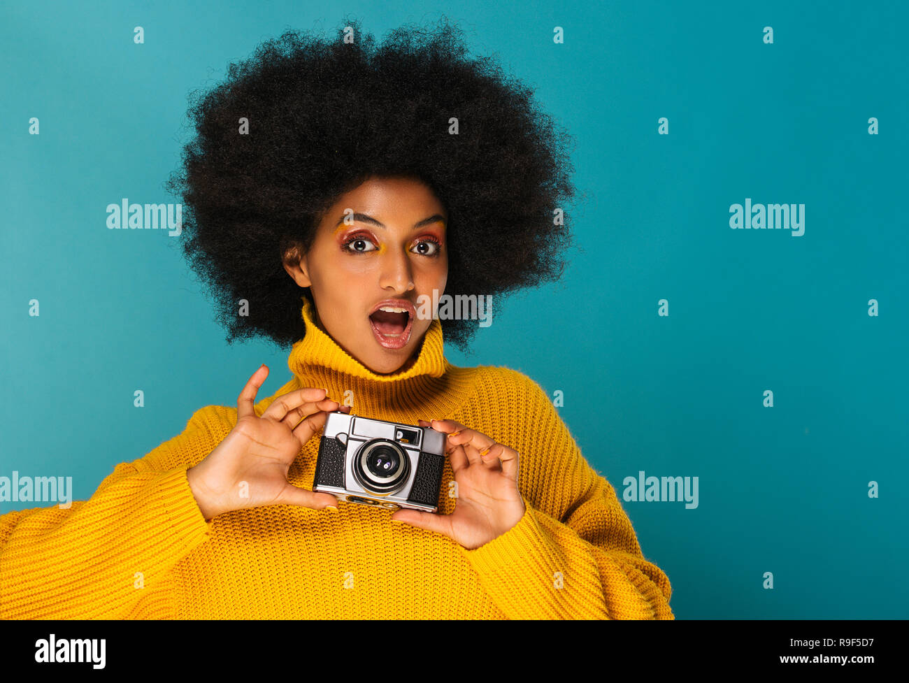 Portrait of pretty afro american woman in a studio for a beauty session ...