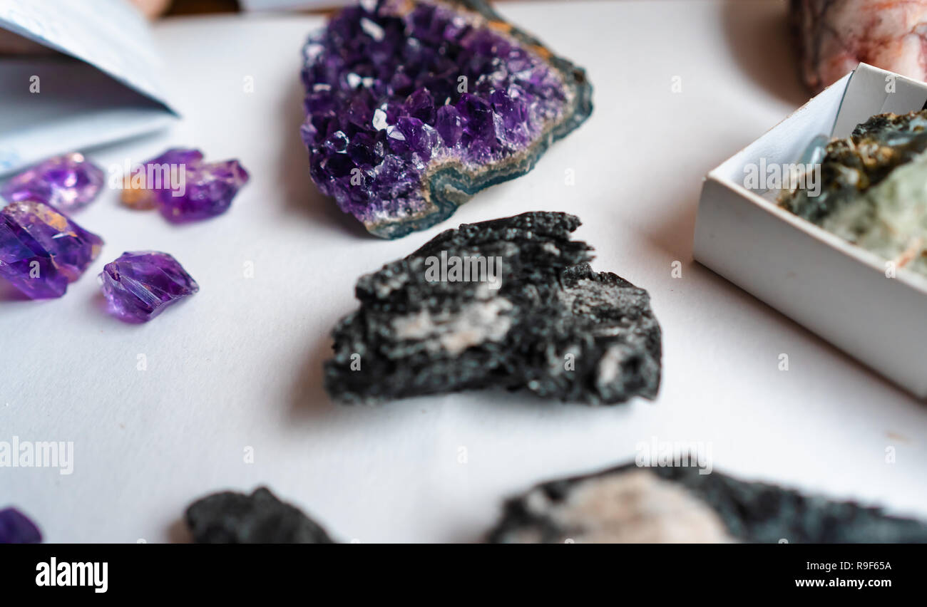 Collection of beautiful precious stones on white table Stock Photo - Alamy