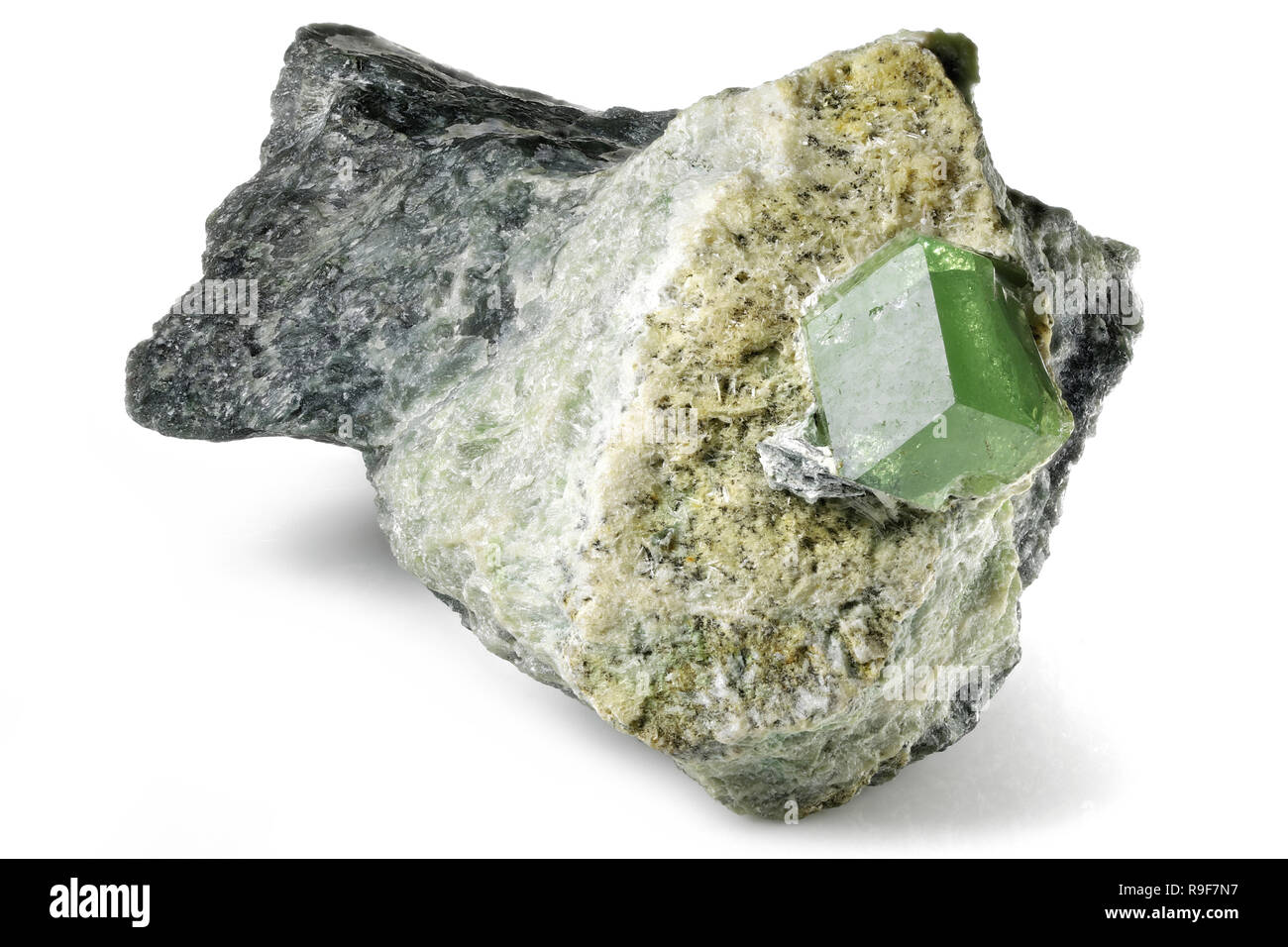 green garnet on matrix from Khost, Afghanistan isolated on white ...