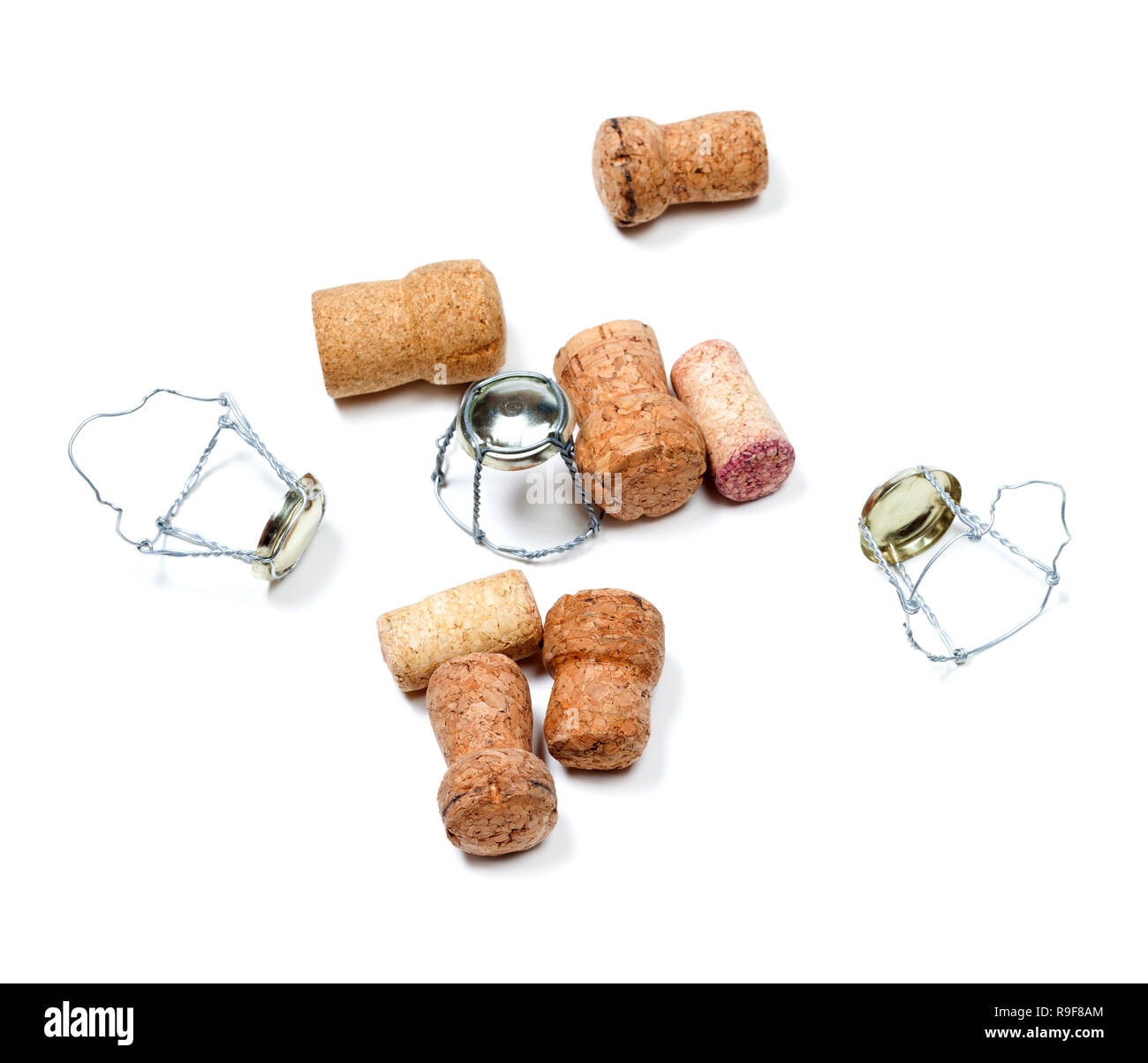 Corks from champagne wine and muselets after party. Isolated on white ...