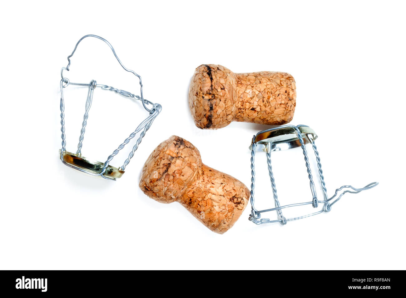 Corks from champagne wine and muselets after party. Isolated on white ...