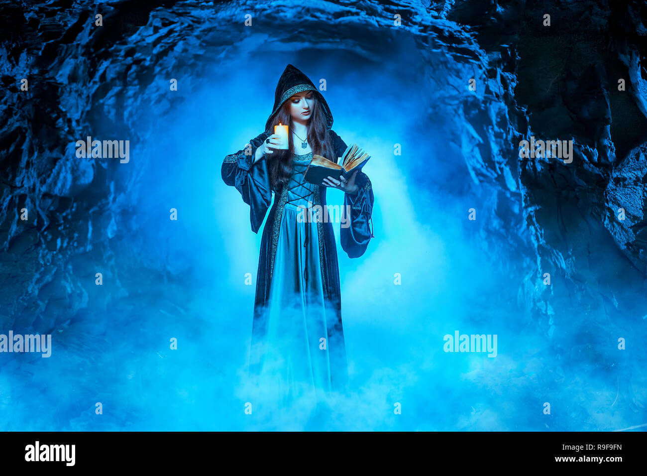 The witch with magic ball in her hands causes a spirits Stock Photo - Alamy