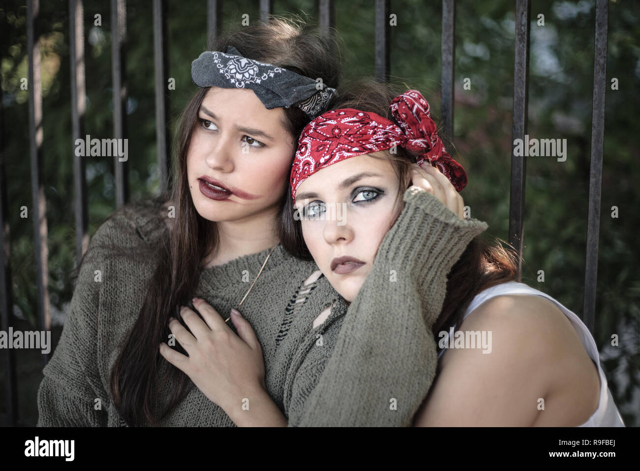 Portrait of two girls outdoors. The concept of difficult teenagers, bad ...