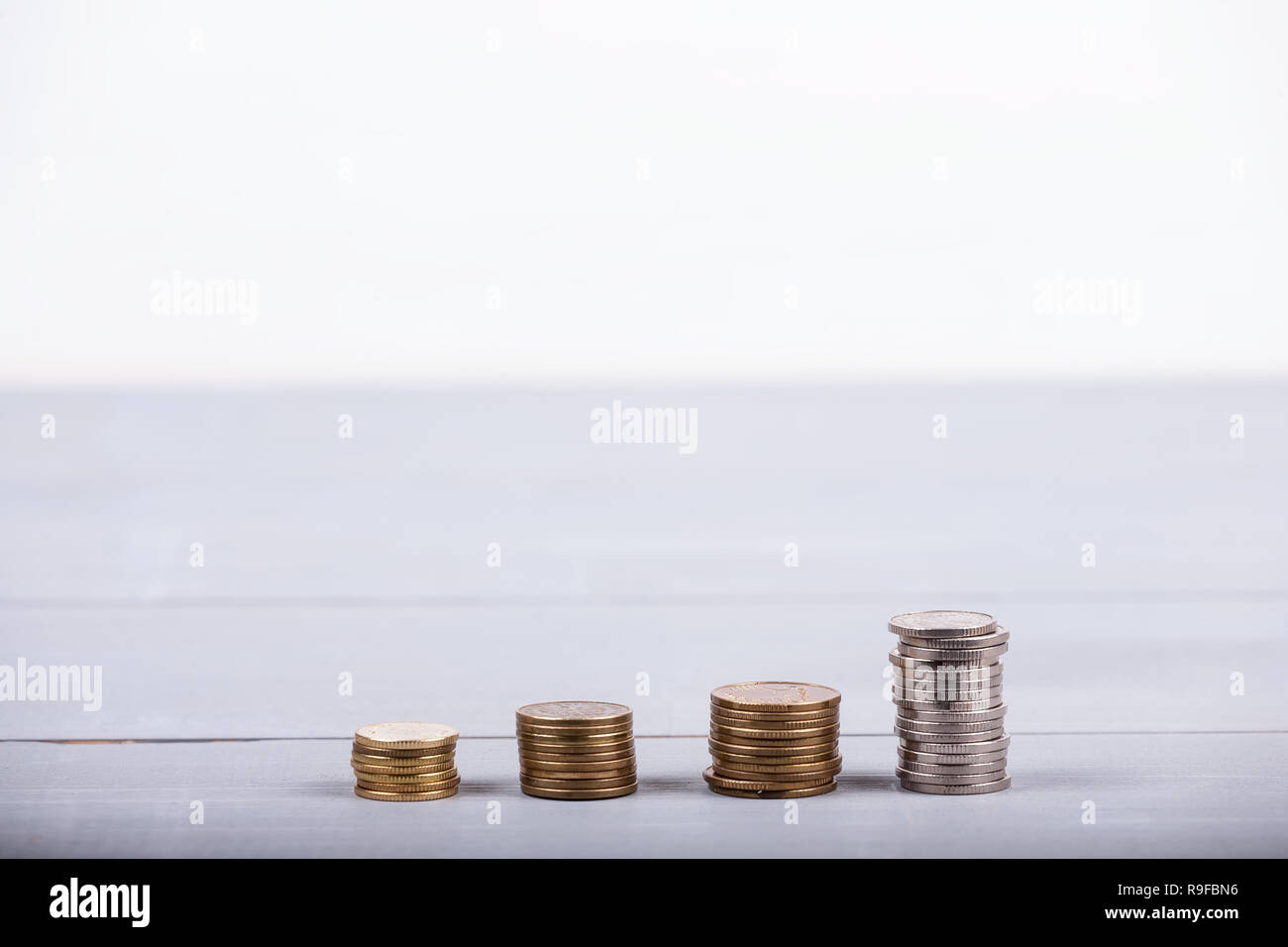Money change coins stacks natural grey light white wooden background ...