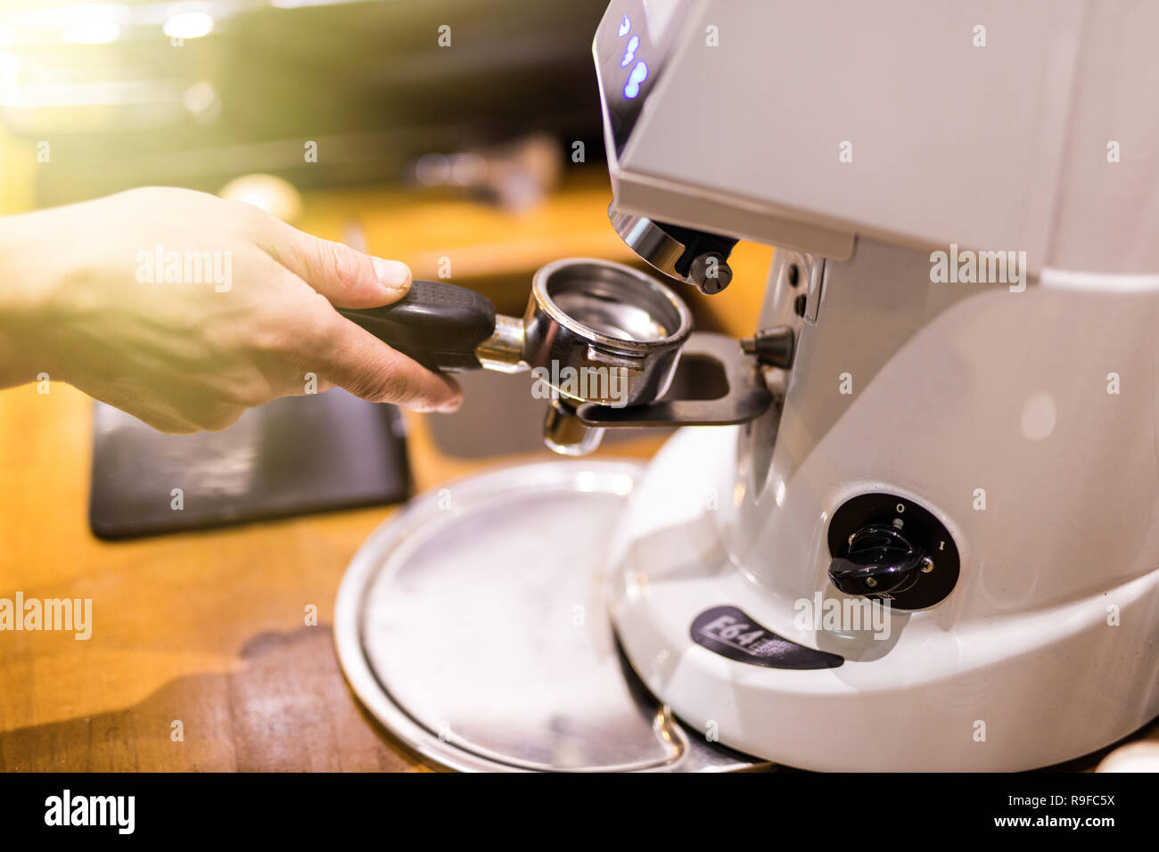Freshly coffee powder in coffee holder from coffee maker machine ...