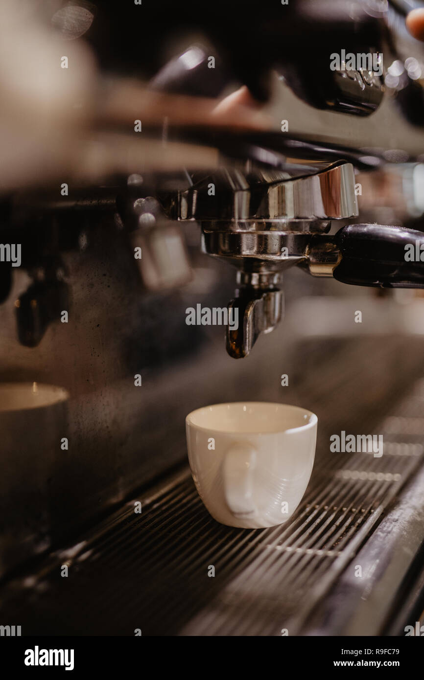 Coffee extraction from professional coffee machine in cafe Stock Photo ...