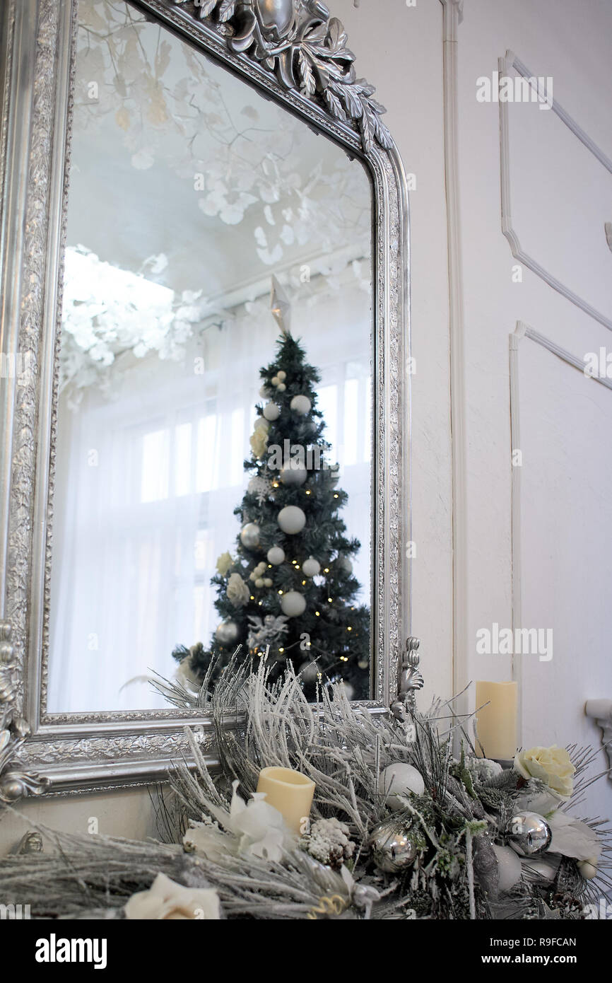 Christmas tree reflection in the mirror.Christmas atmosphere in a ...