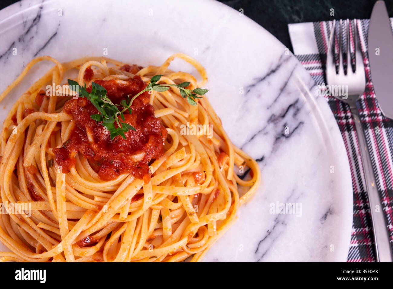 Delicious spaghetti served on a marble plate Stock Photo - Alamy