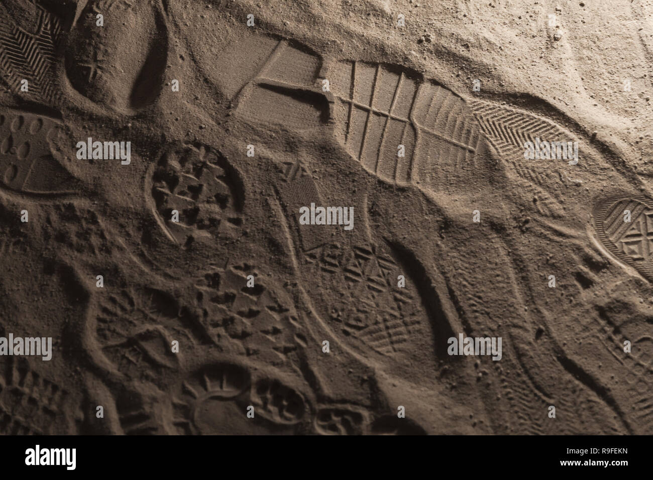 Footprints in dark dusty ground, background photo texture Stock Photo ...