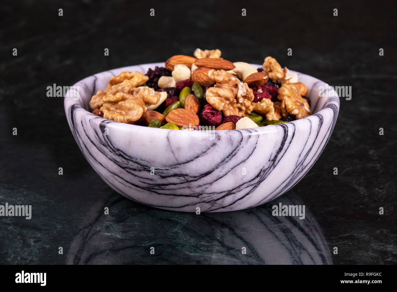 Nuts mix in a marble plate Stock Photo - Alamy