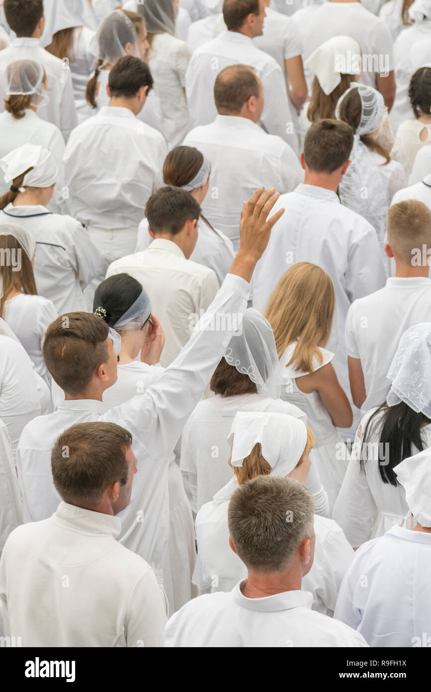 Many men and women pray to Jesus. vertical photo Stock Photo - Alamy