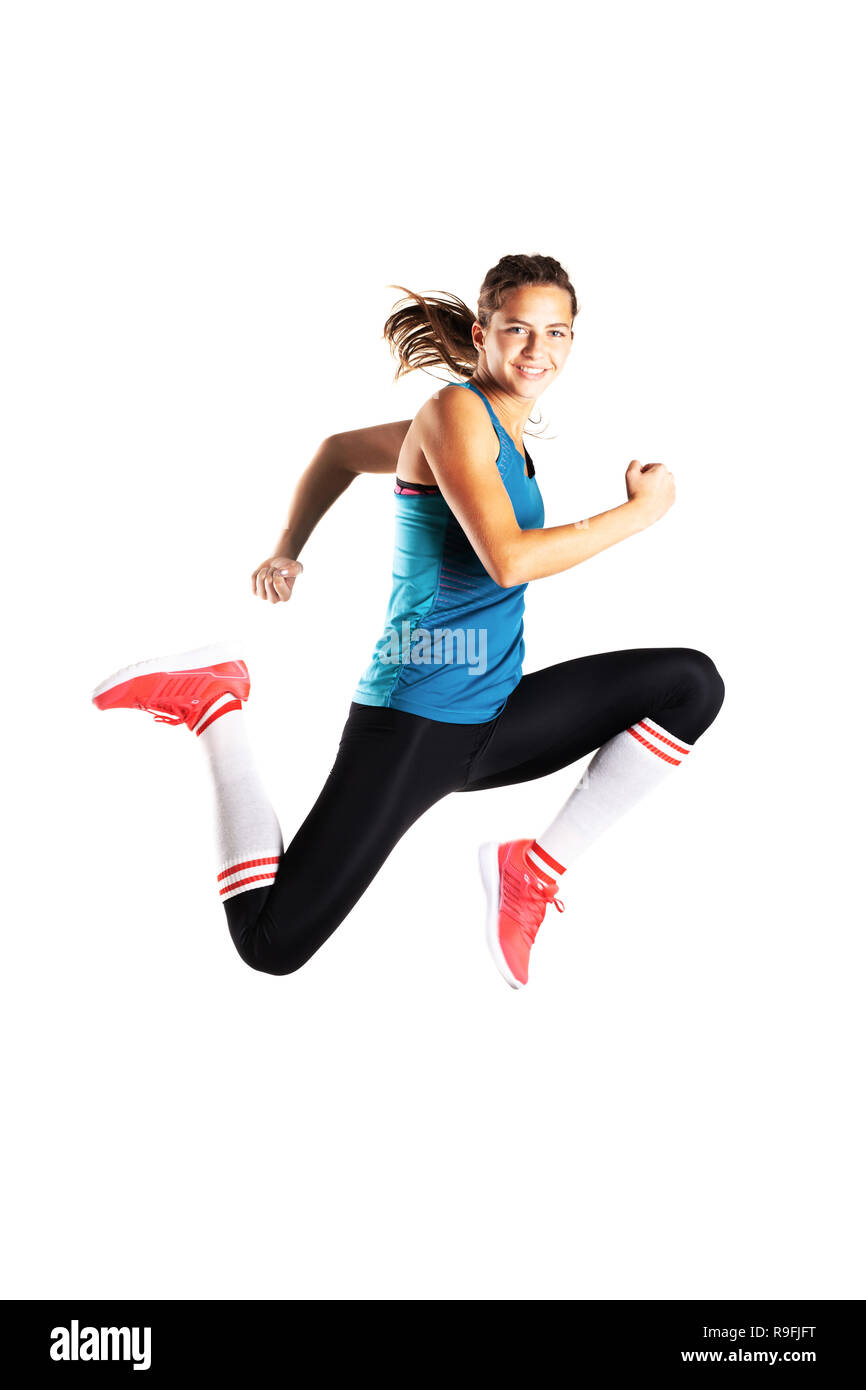 fit runner girl jumping with happy expression against white background ...