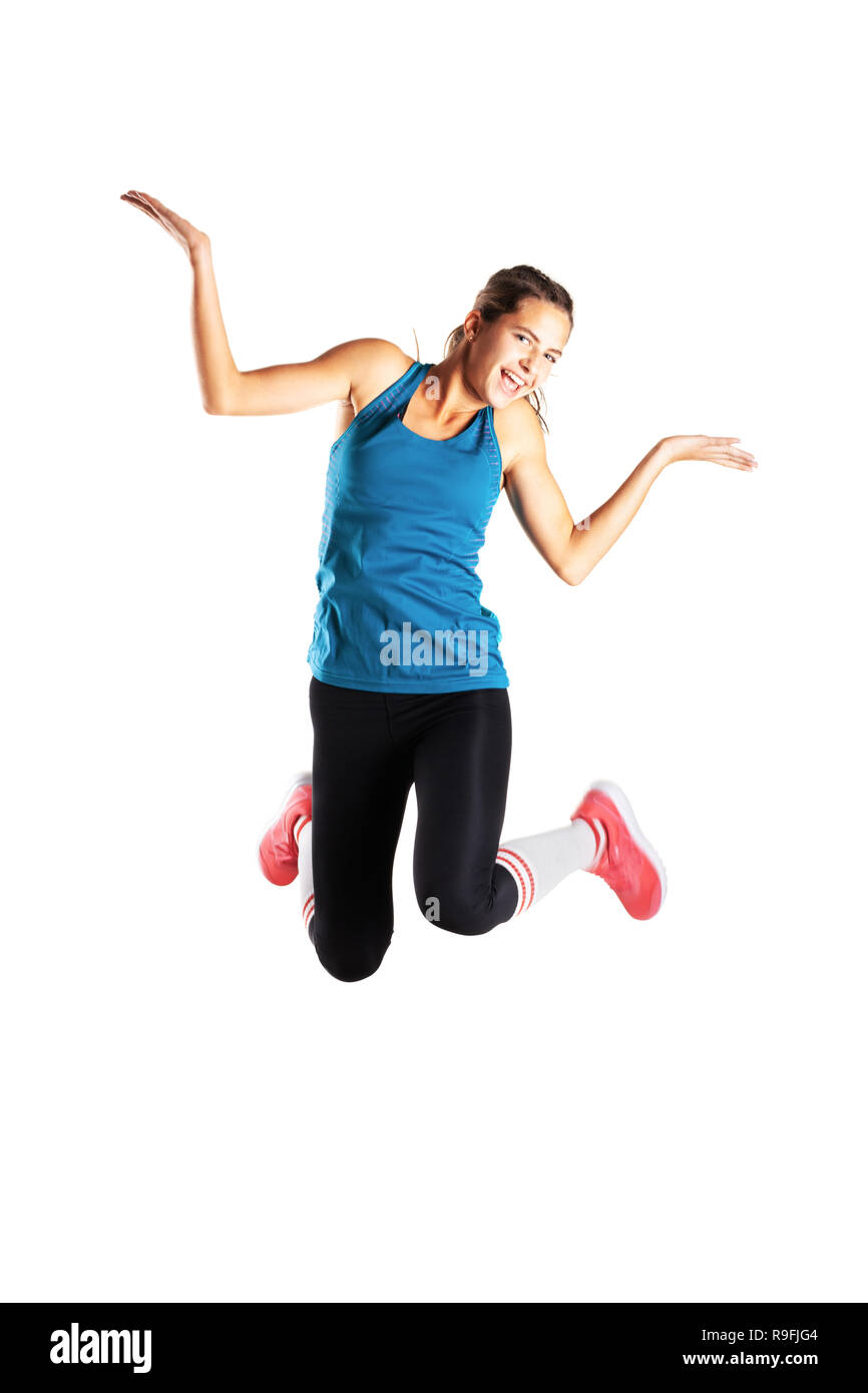 fit runner girl jumping with happy expression against white background ...