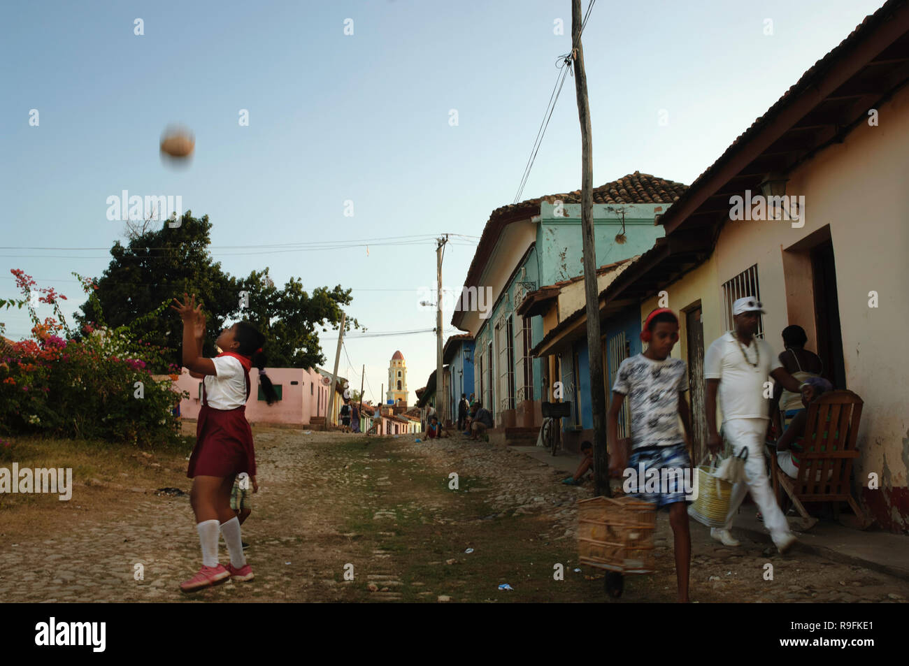 Street scene in the old part of Trinidad, Cuba, wih the church in the ...