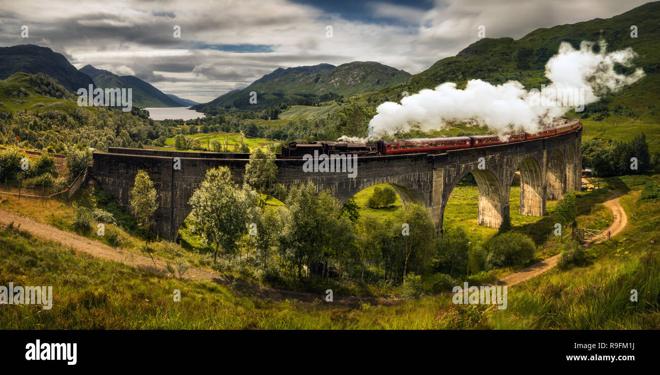 Panorama of Jacobite steam train on old bridge, Scotland Stock Photo ...