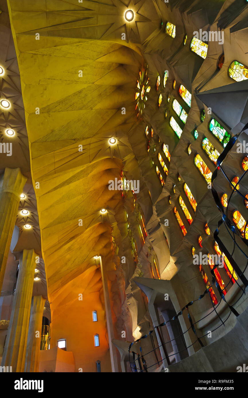 Colourful bright rays of light shining on the ceiling of Sagrada ...