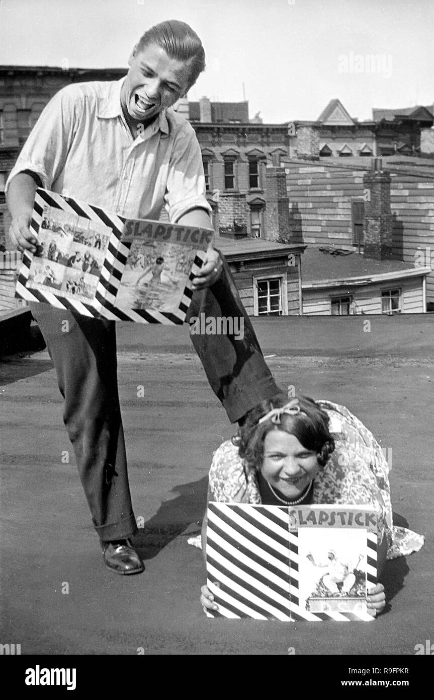 A young couple clowns around a pose for a picture with Slapstick ...