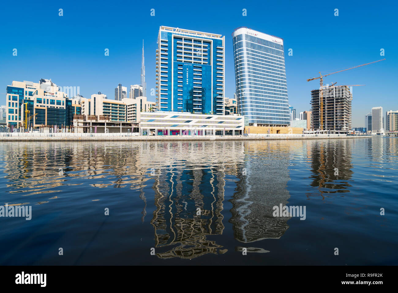 Daytime view of modern skyline of Business Bay and The Creek waterway ...