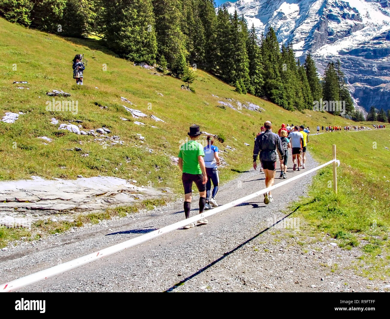 Traditional bagpiper at the famous Jungfrau region - Witzerland Stock ...