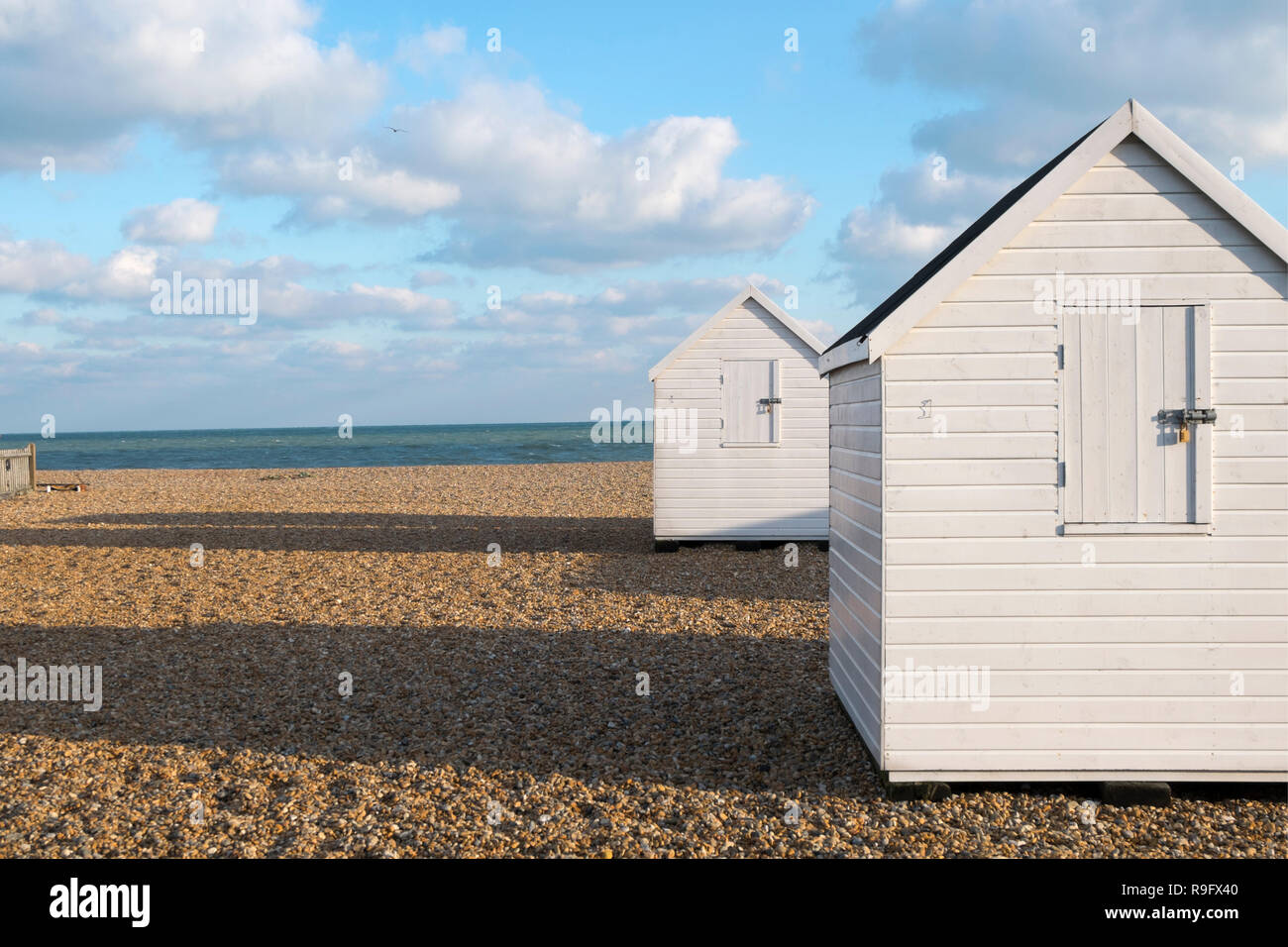 White beach huts along the front at Walmer, Deal, Kent, UK Stock Photo ...