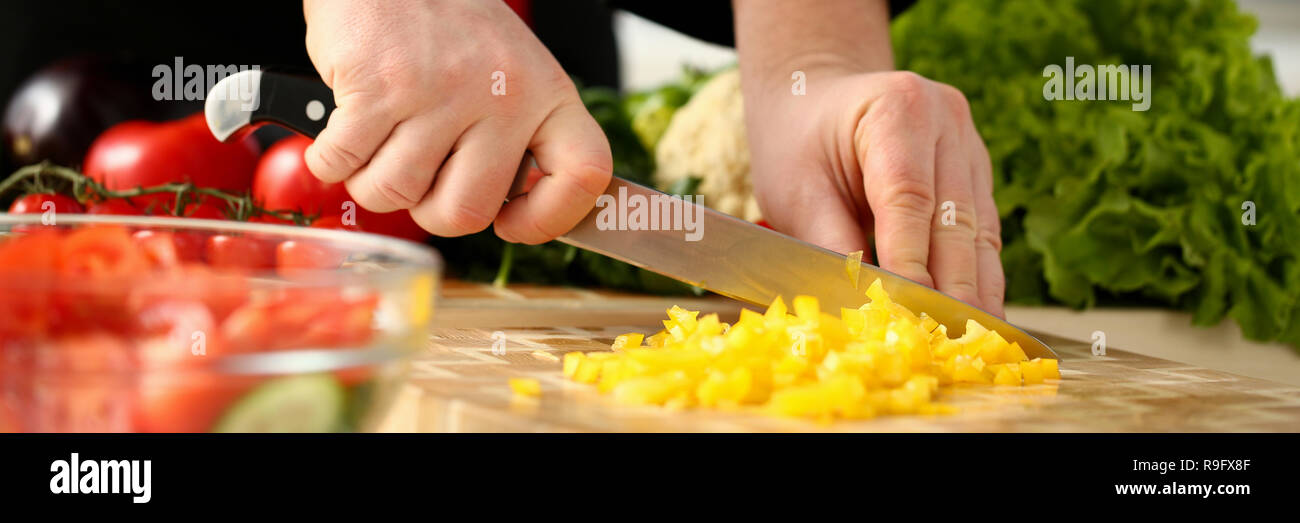 Hand cook cuts pepper on hi-res stock photography and images - Alamy