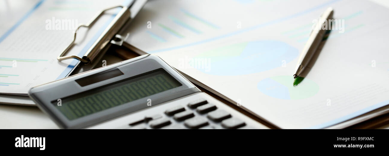 Silver calculator with gray keyboard is lying Stock Photo - Alamy