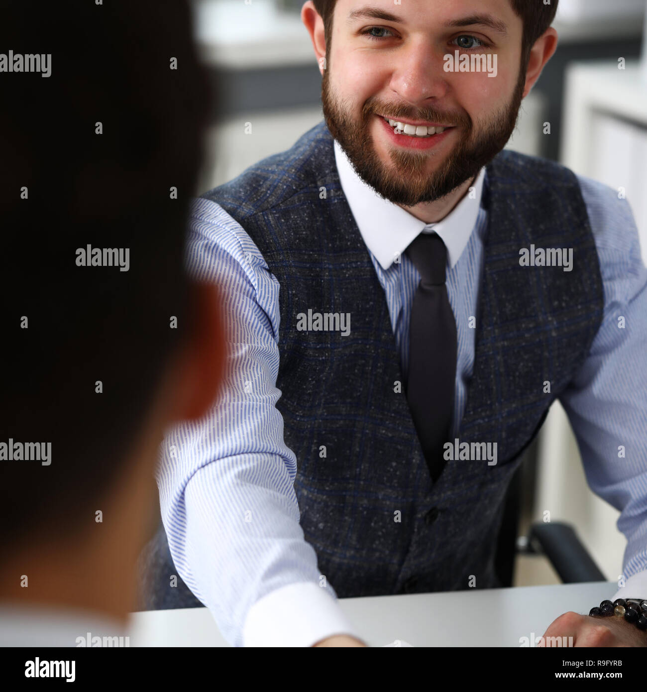 Man in suit and tie give hand as hello in office Stock Photo - Alamy