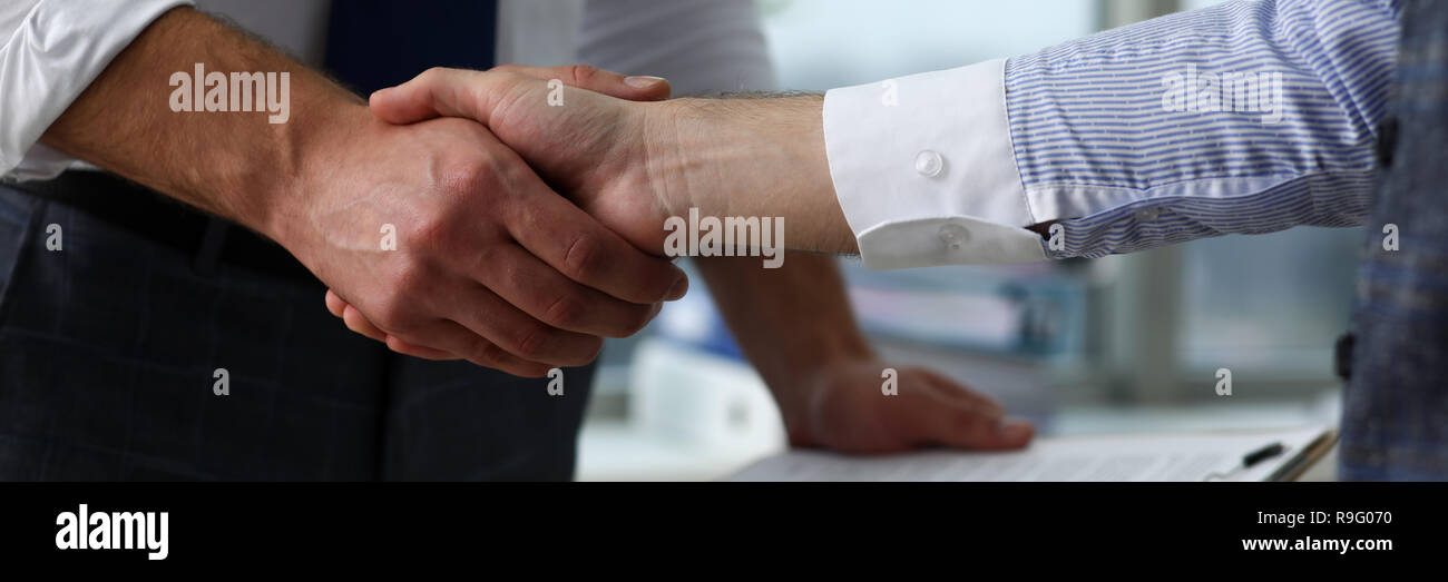 Man in suit and tie give hand as hello in office closeup Stock Photo ...