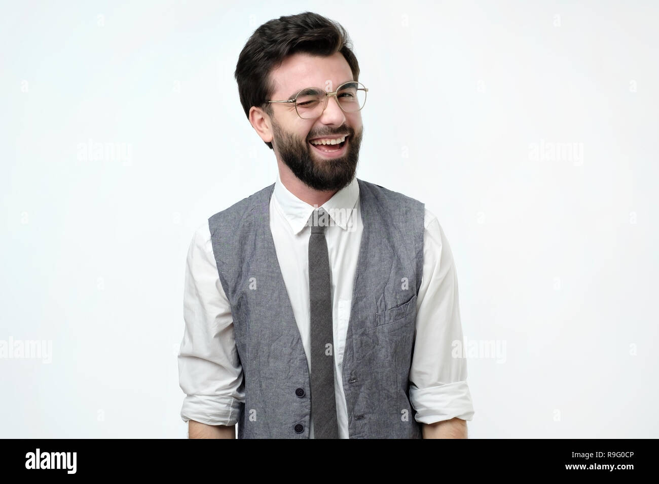 Handsome young man beard winking hi-res stock photography and images ...