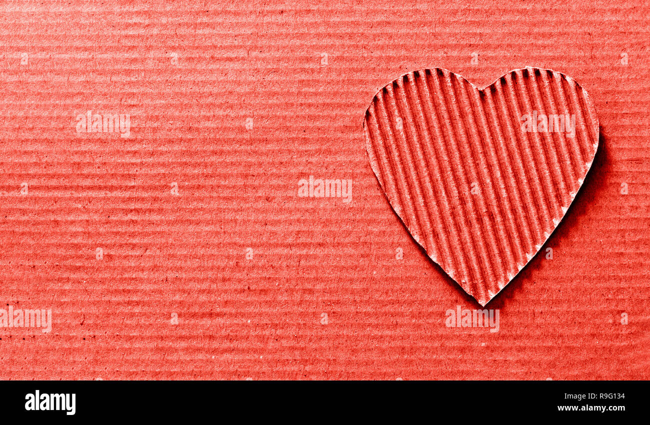 heart symbol carved out of corrugated cardboard. Copy space, top view ...