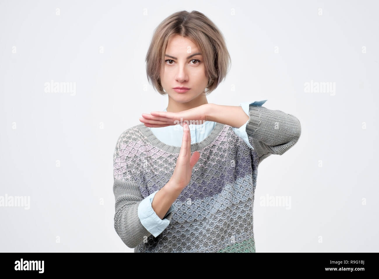 portrait of attractive caucasian woman showing time out sign Stock ...