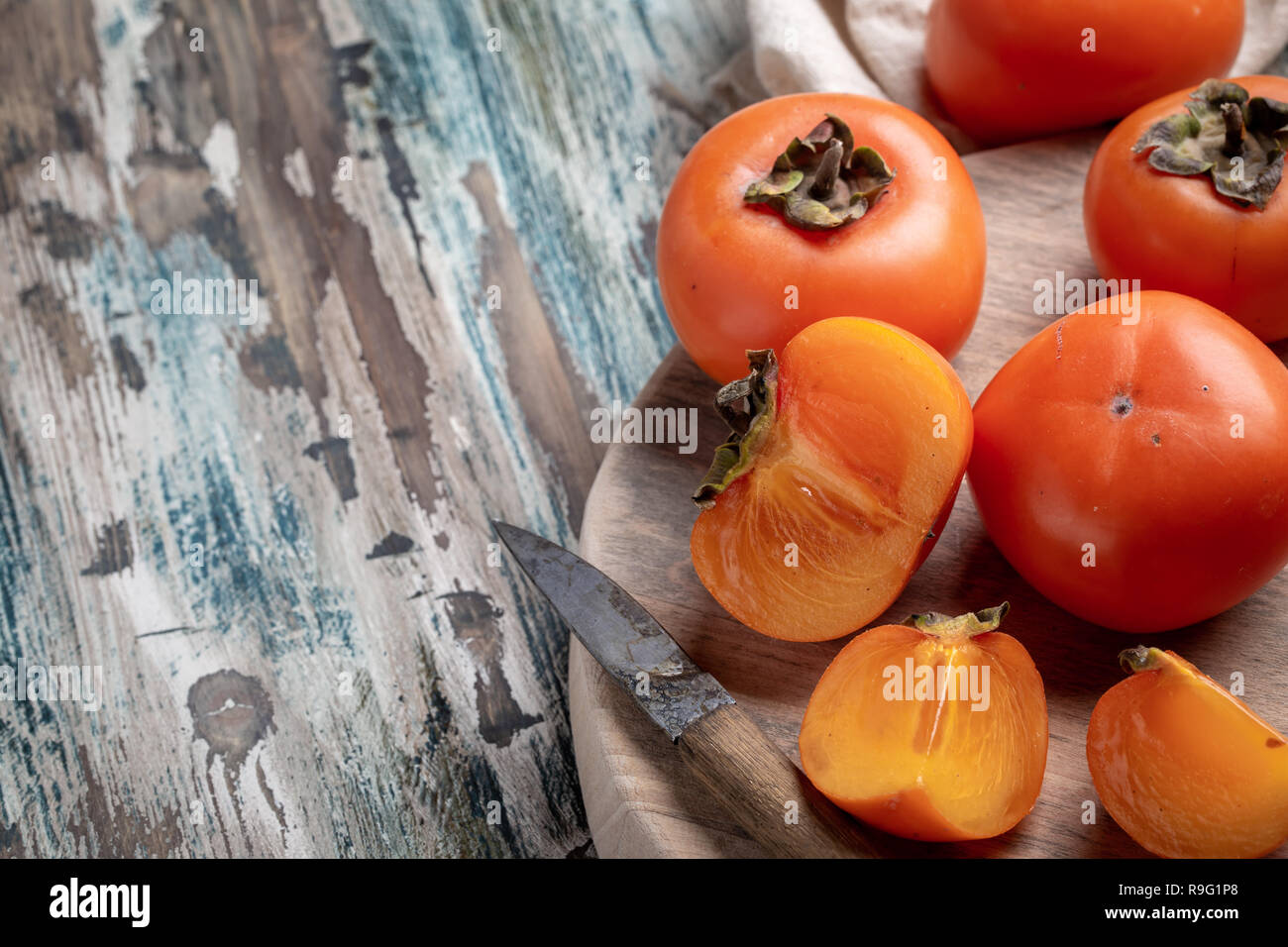 Fresh persimmon fruits copyspace Stock Photo - Alamy