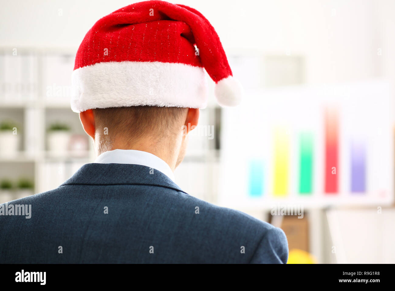 Man in suit wearing traditional red cap Stock Photo - Alamy