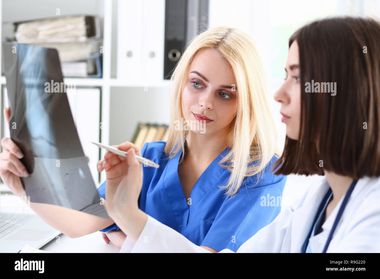 Group of beautiful female doctors hold Stock Photo - Alamy