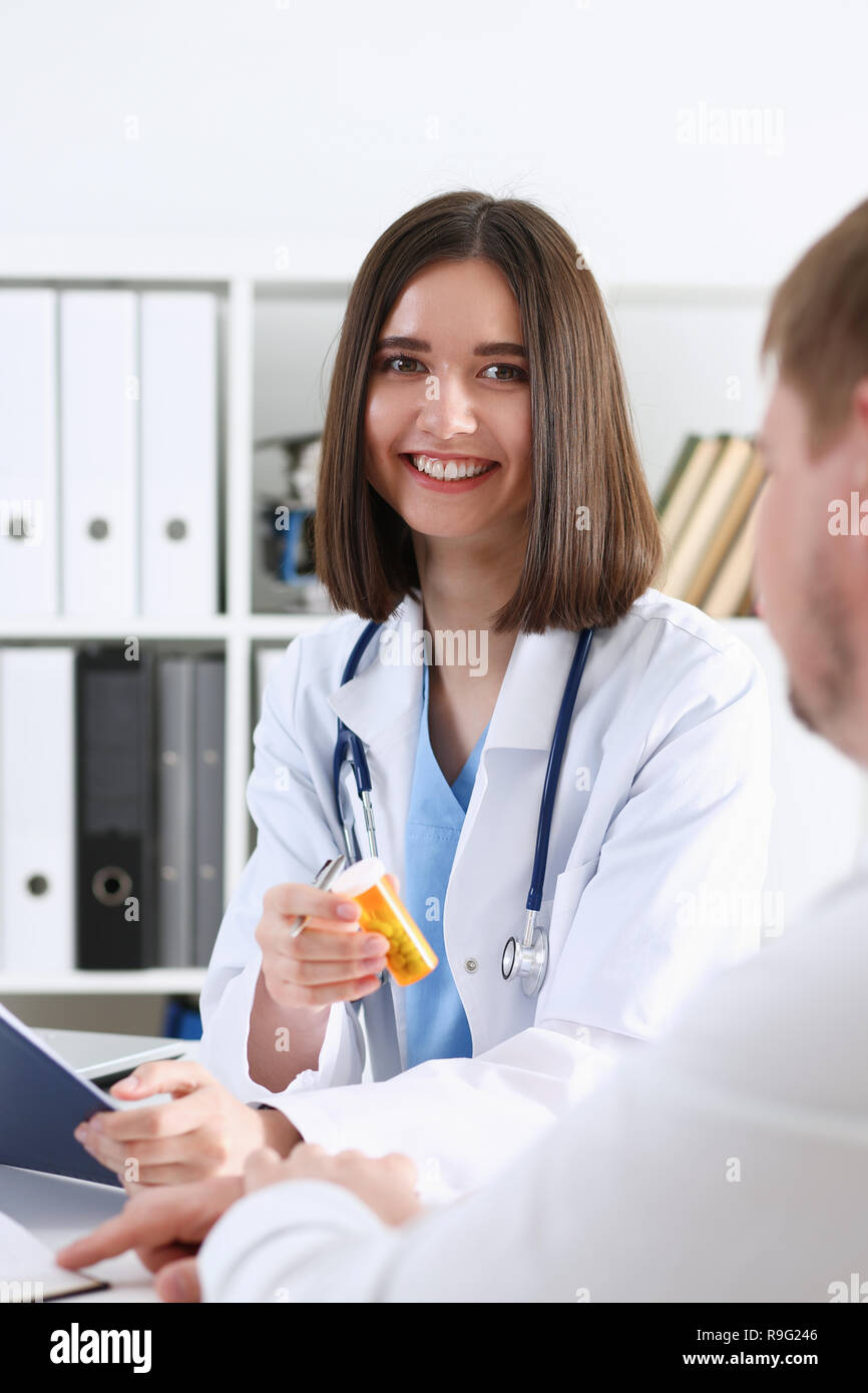 Female medicine doctor write prescription Stock Photo - Alamy