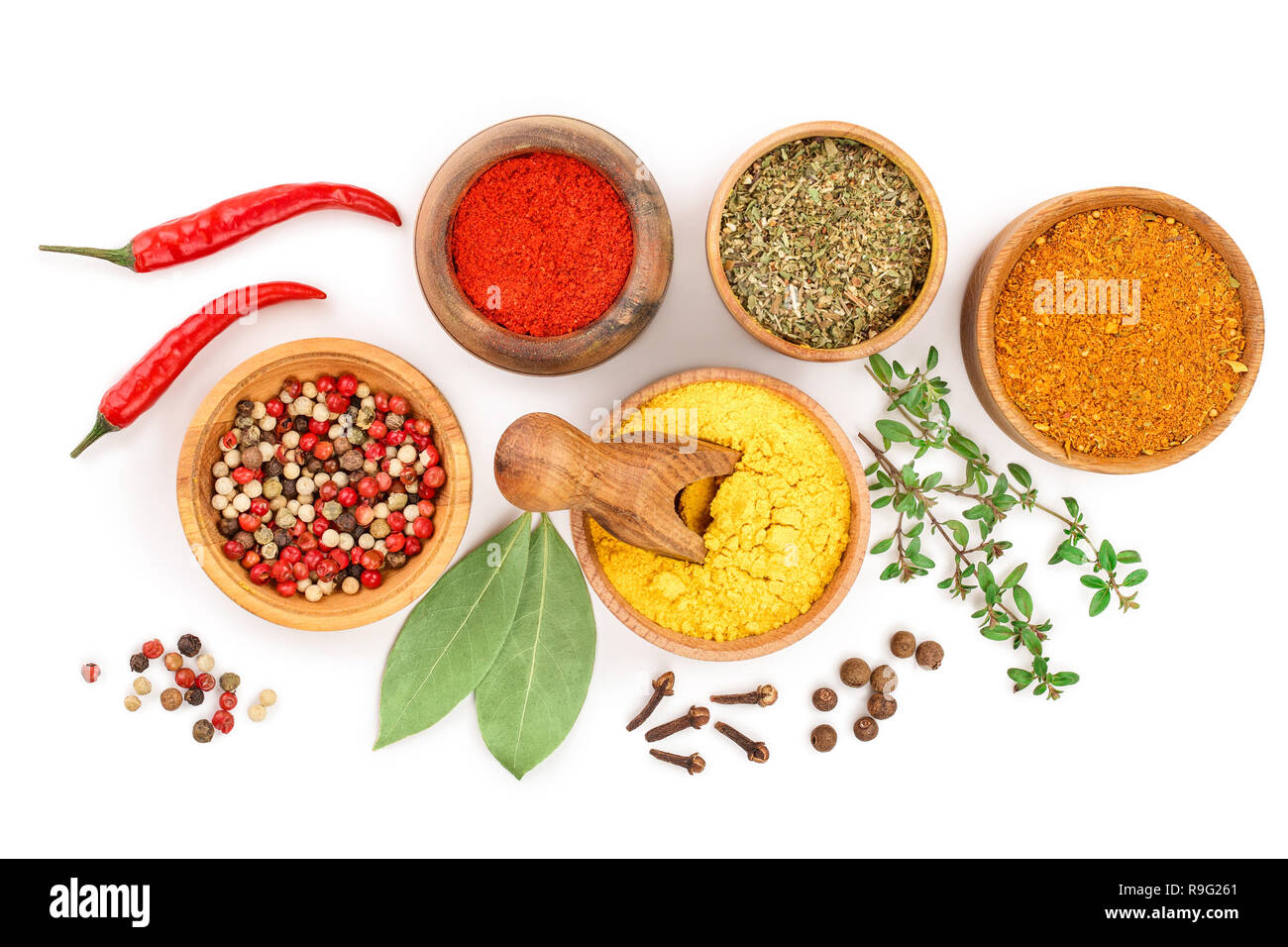 mix of spices in wooden bowl isolated on a white background. Top view ...
