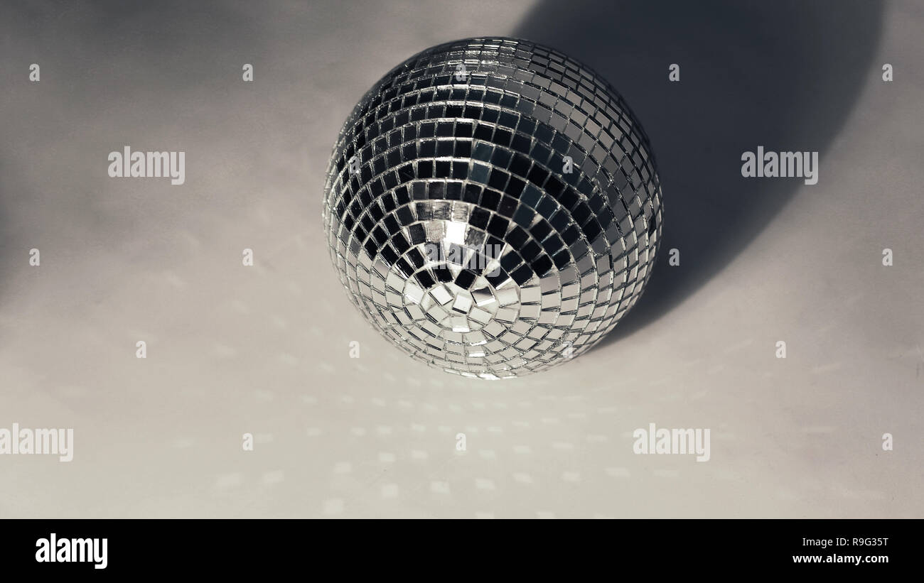 beautiful disco ball on yellow background isolated Stock Photo - Alamy