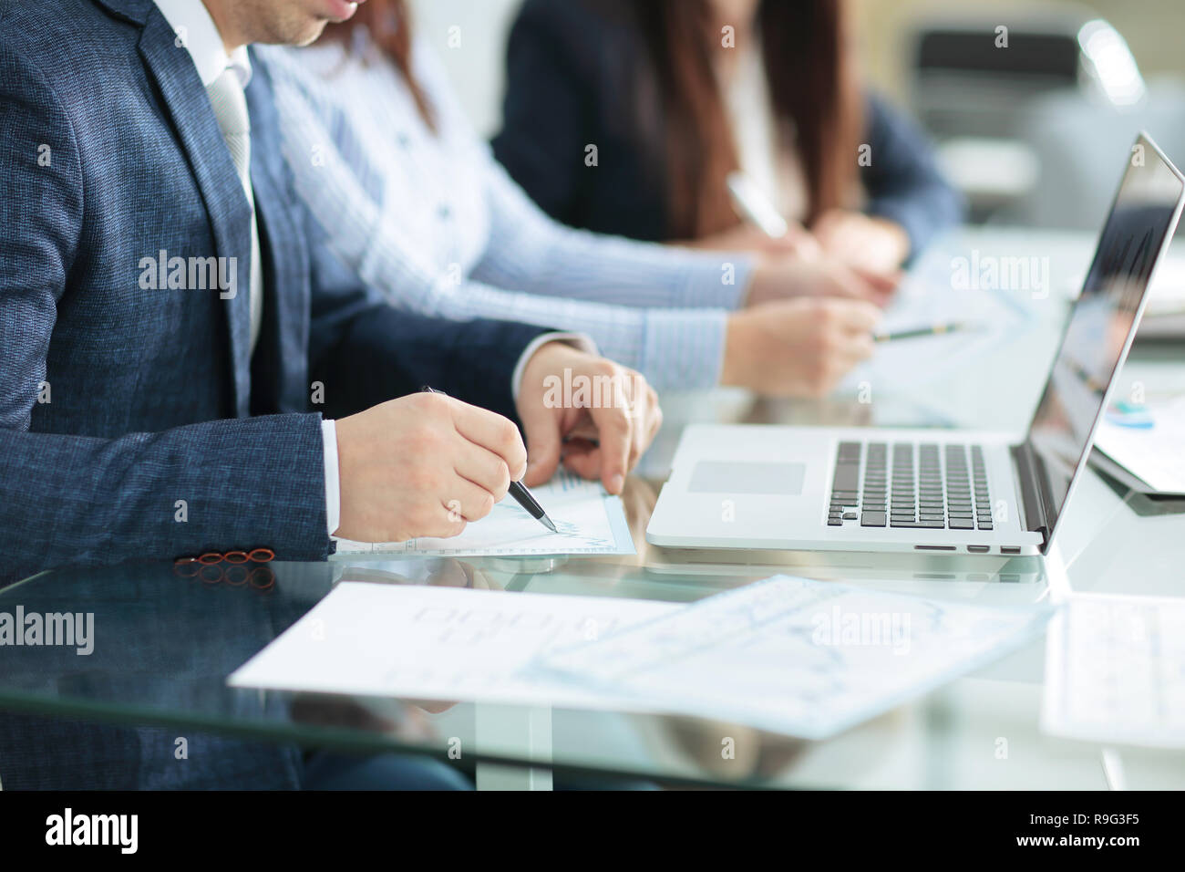 Business people checking laptop rate hi-res stock photography and ...