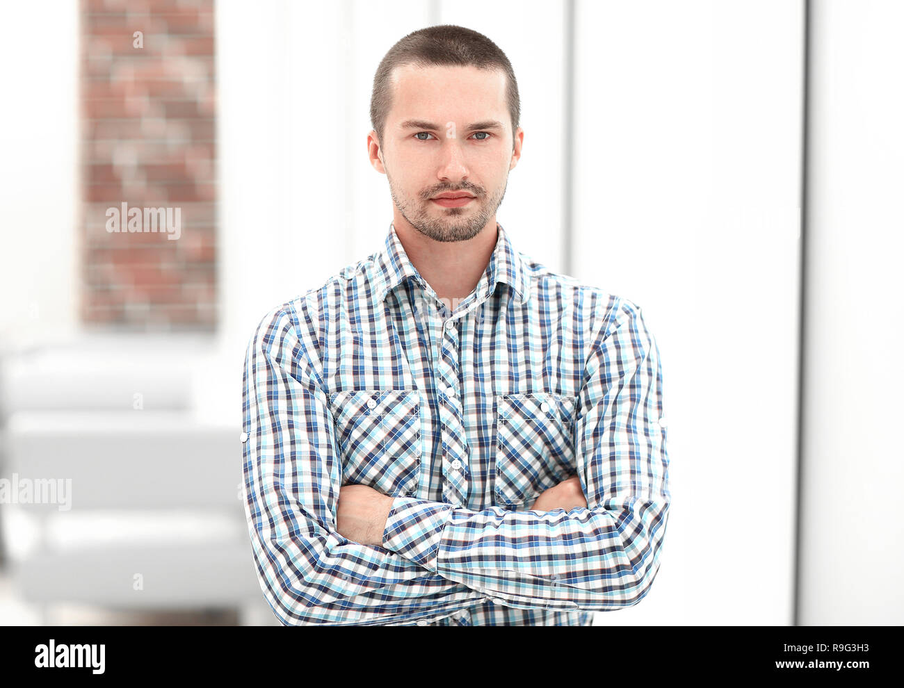 young employee standing next to office window Stock Photo - Alamy