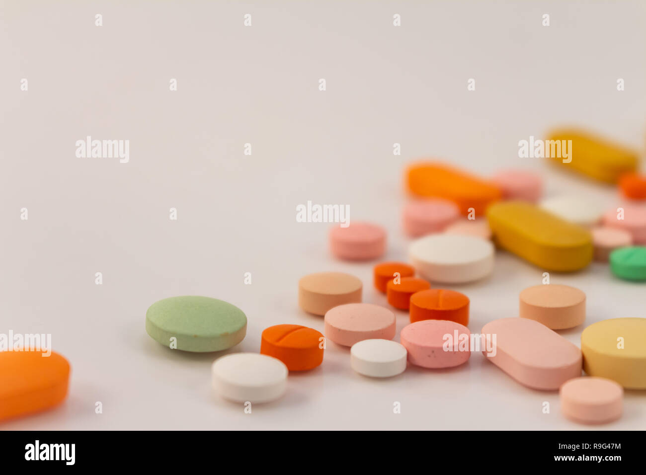 Drugs in the form of medicines. Capsules and tablets of various colors ...