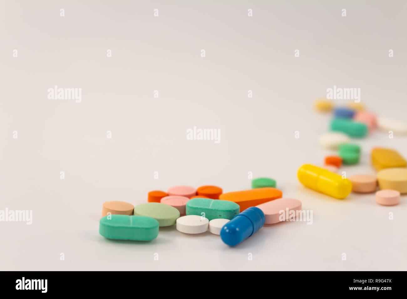 Drugs in the form of medicines. Capsules and tablets of various colors ...