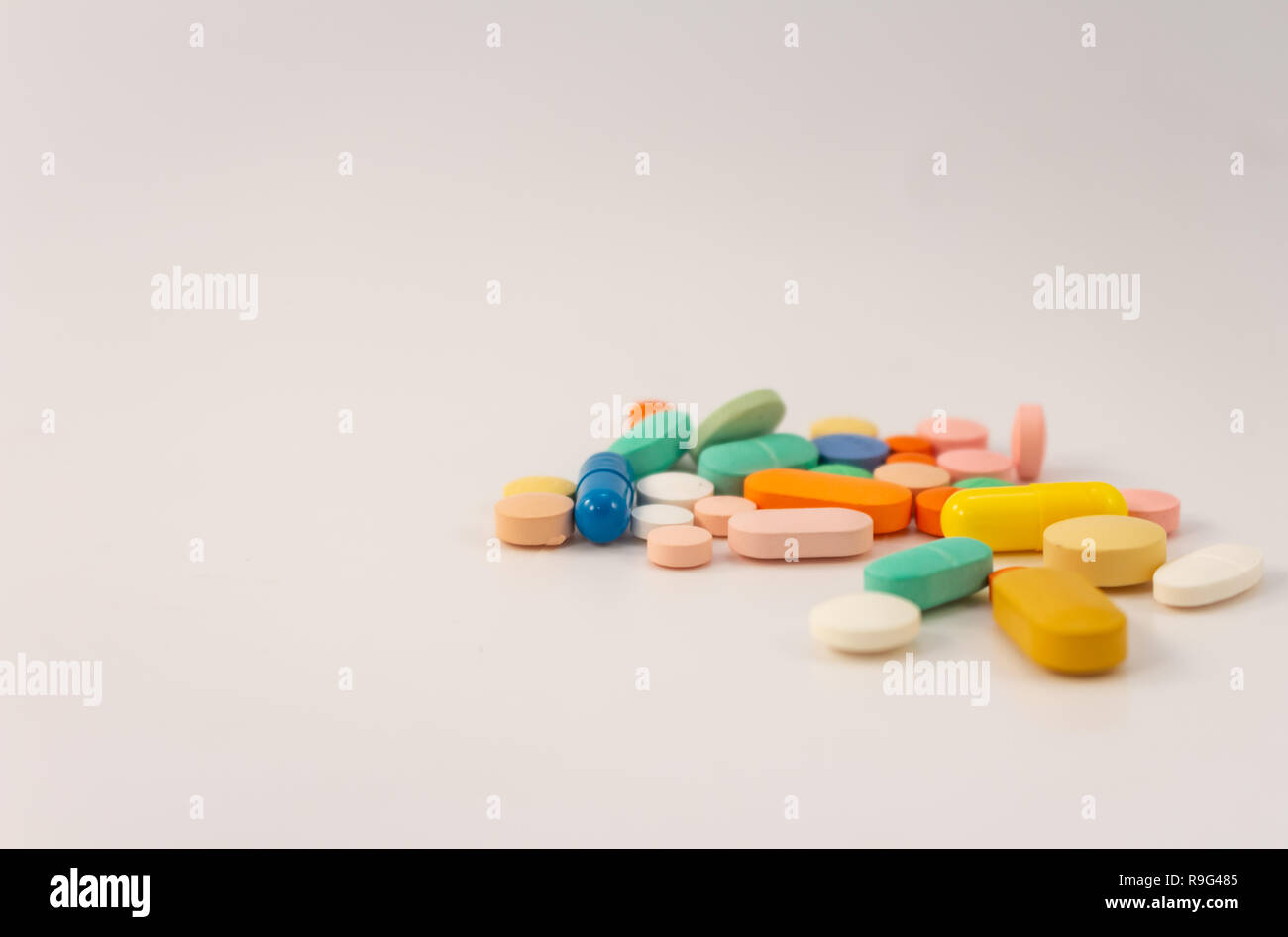 Drugs in the form of medicines. Capsules and tablets of various colors ...