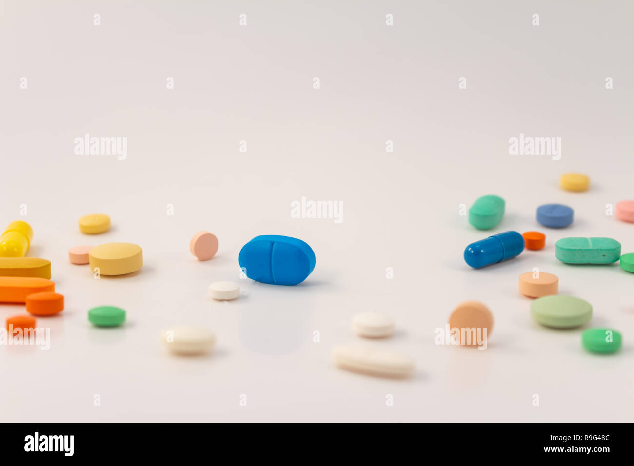 Drugs in the form of medicines. Capsules and tablets of various colors ...