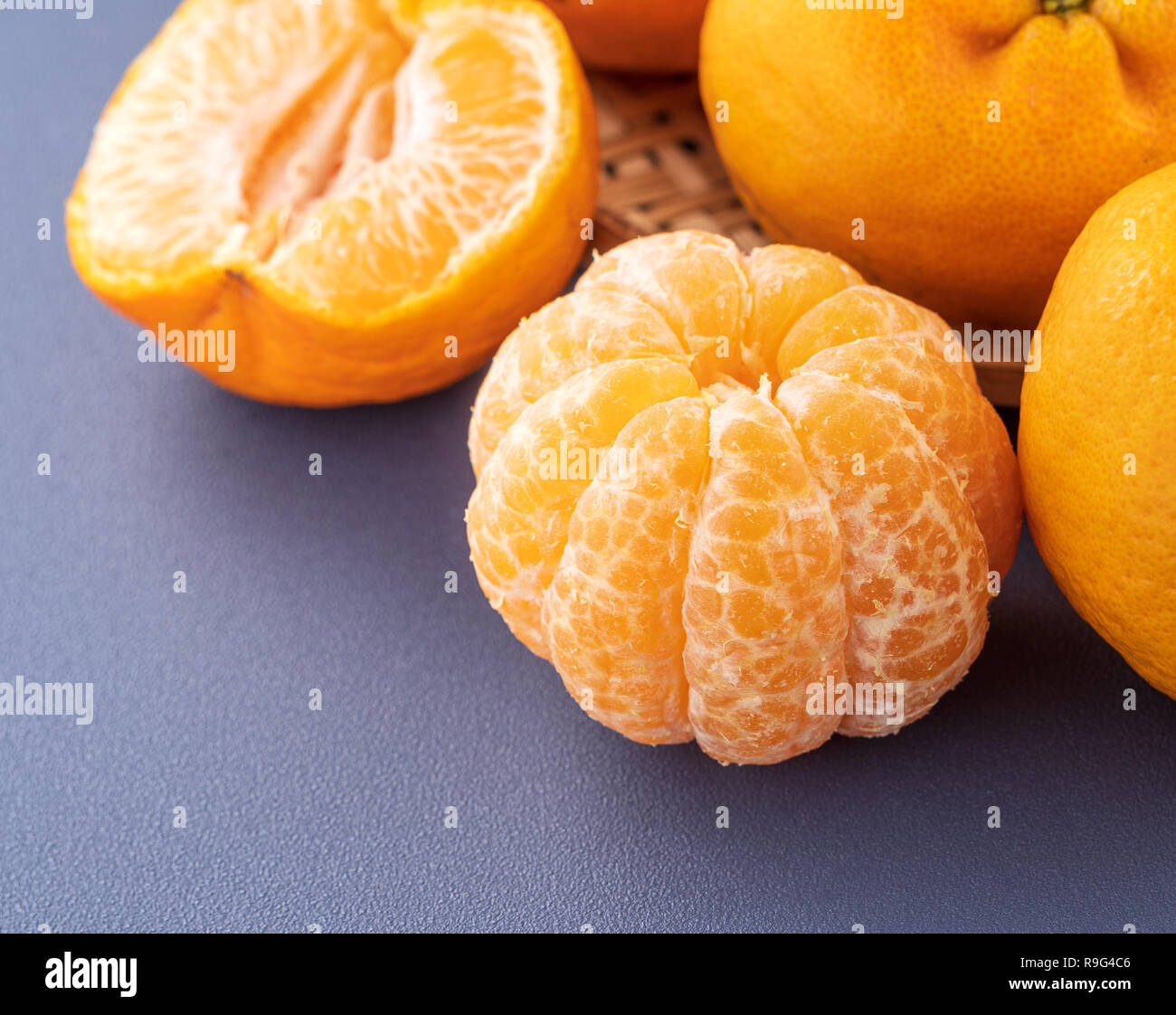 Beautiful and delicous tangerine isolated on airy blue background with ...