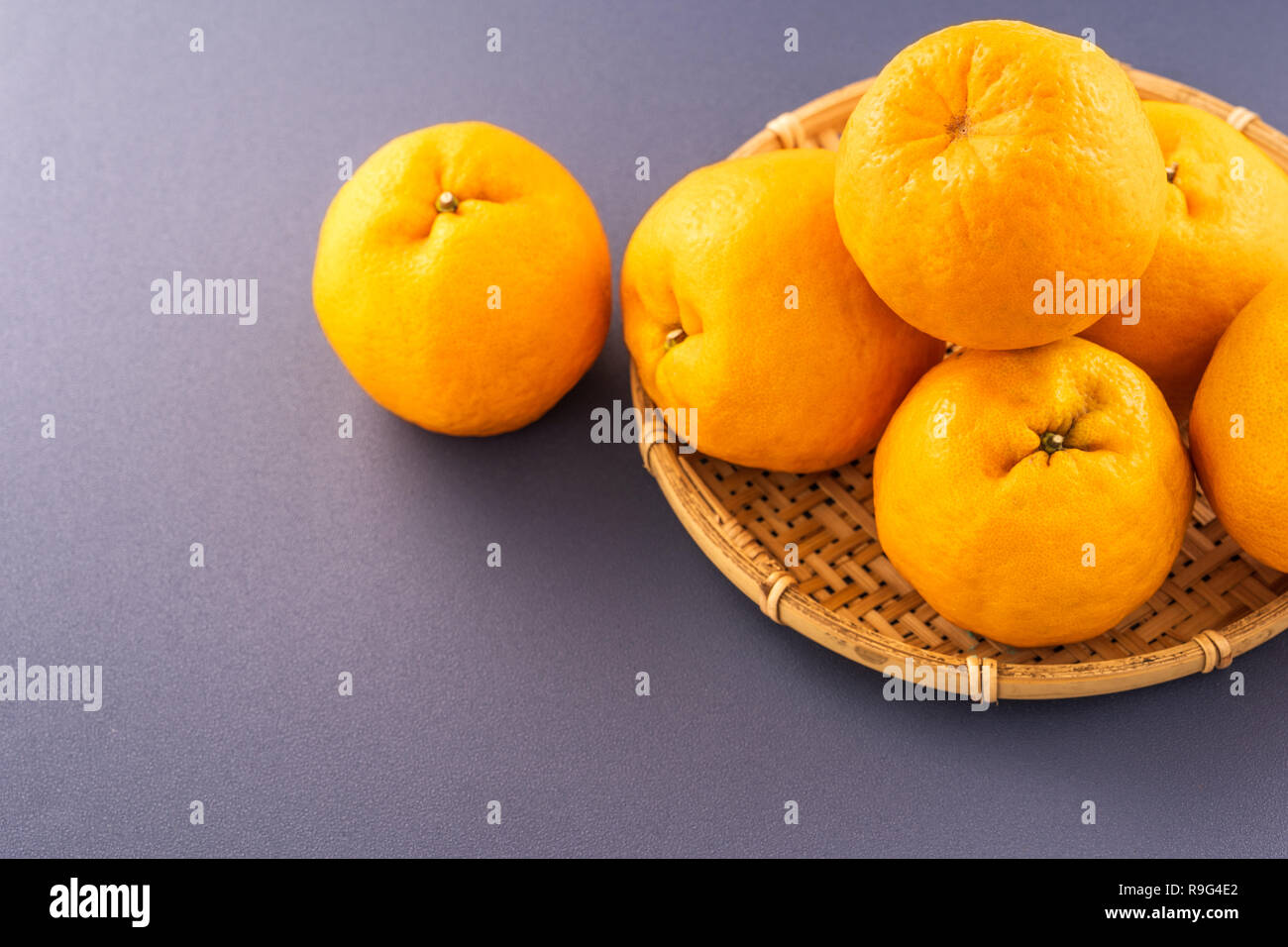 Beautiful and delicous tangerine isolated on airy blue background with ...