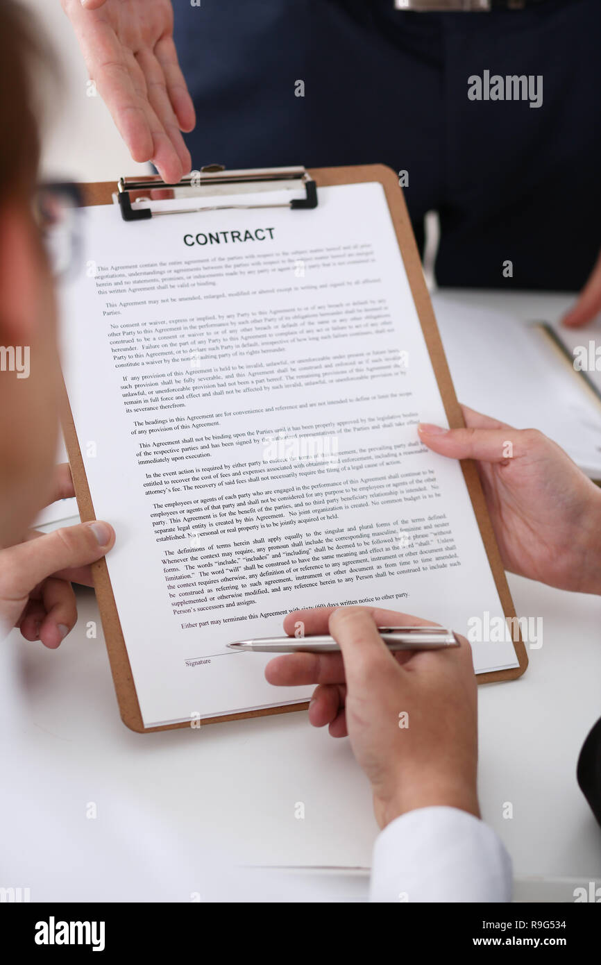 Male arm in shirt offer contract form on clipboard Stock Photo - Alamy