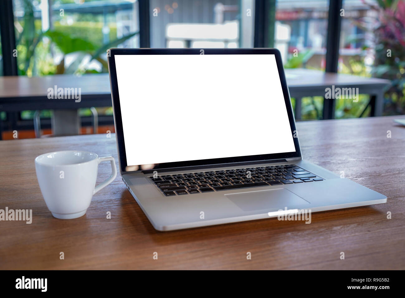 mock up Using laptop with blank screen computer modern Stock Photo - Alamy