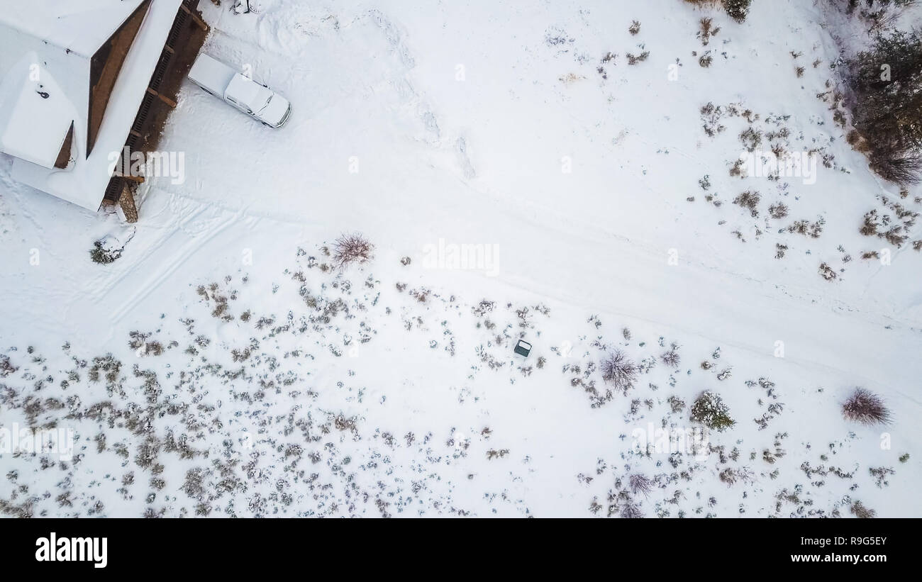 Aerial view of the mountain house covered in snow in the Winter Stock ...