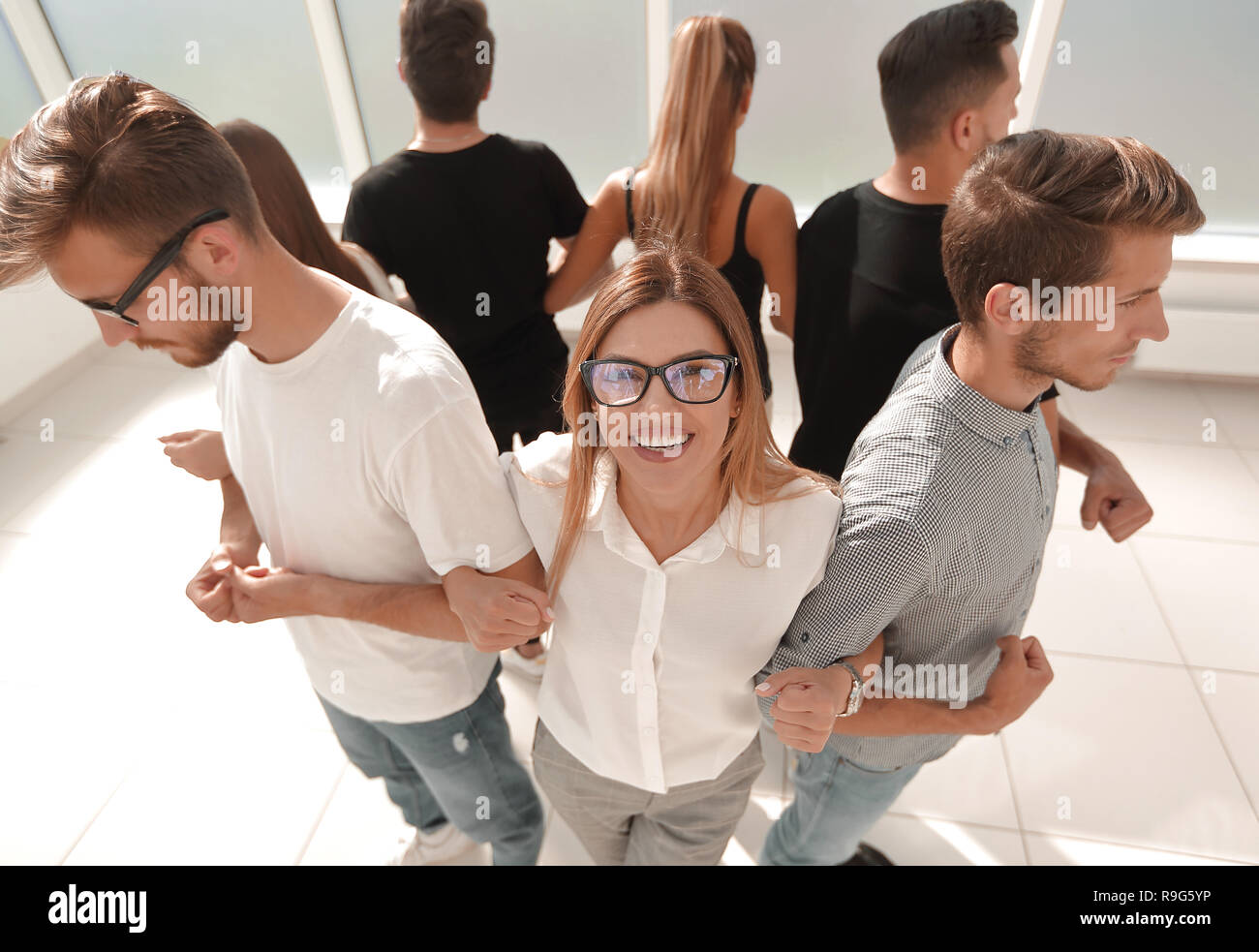 group of friends standing in a circle Stock Photo - Alamy