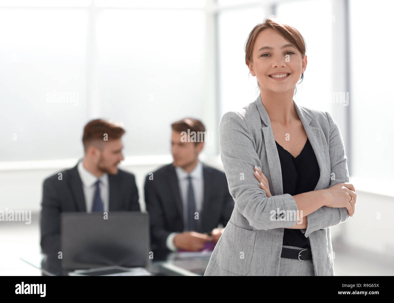 successful business woman standing in office Stock Photo - Alamy